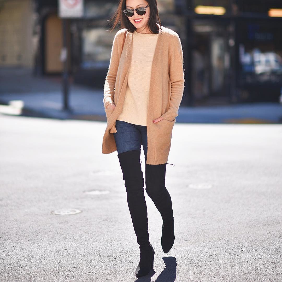 A Cream Sweater A Light Brown Cardigan Skinny Jeans And Black Over